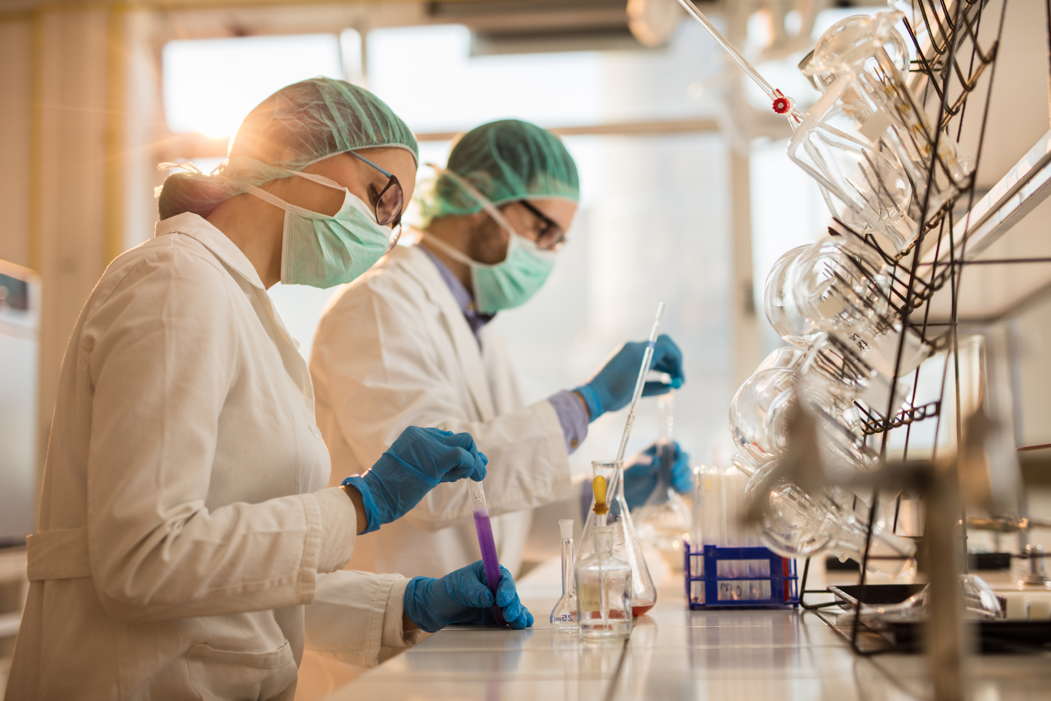 Young chemists working on scientific research in a laboratory ...